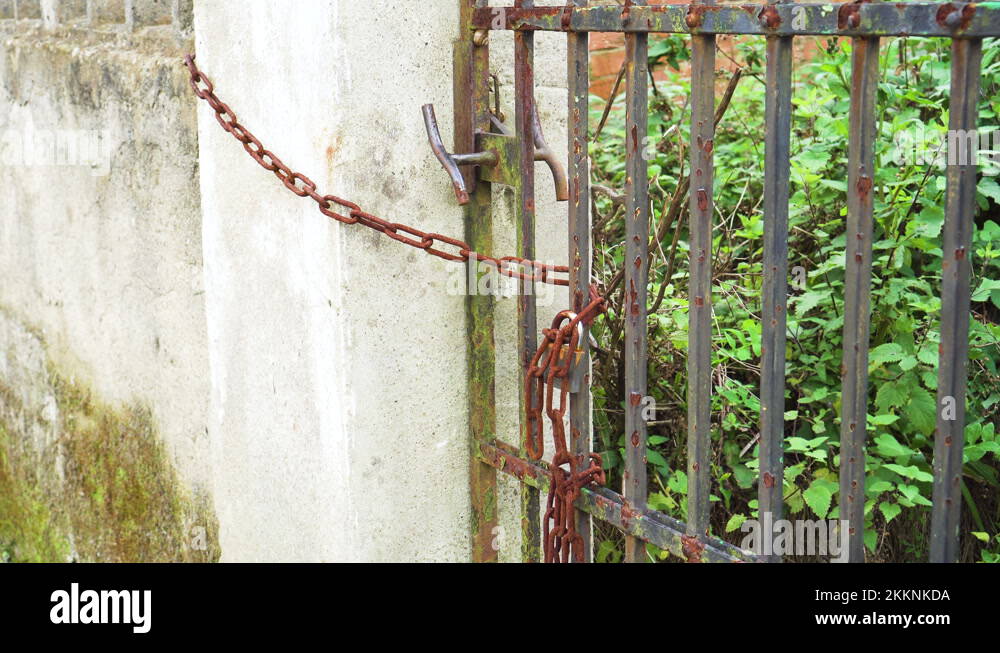 Rusty gate with chain and padlock Stock Videos & Footage - HD and 4K ...