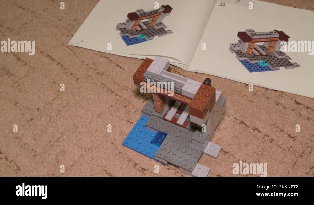 Baby girl and parent father assemble construction set house Stock Video ...