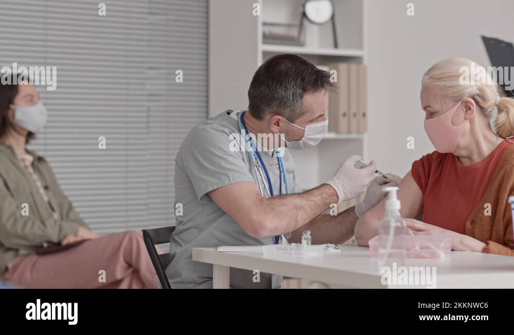 Man giving injection Stock Videos & Footage - HD and 4K Video Clips - Alamy