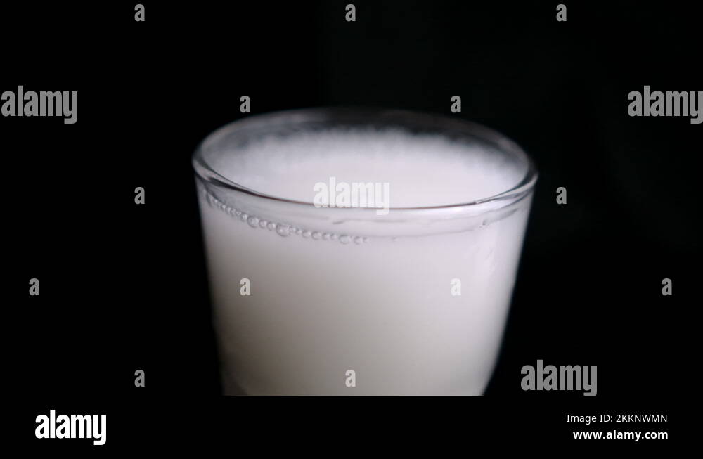 Glass of traditional Mexican horchata water with black background Stock ...