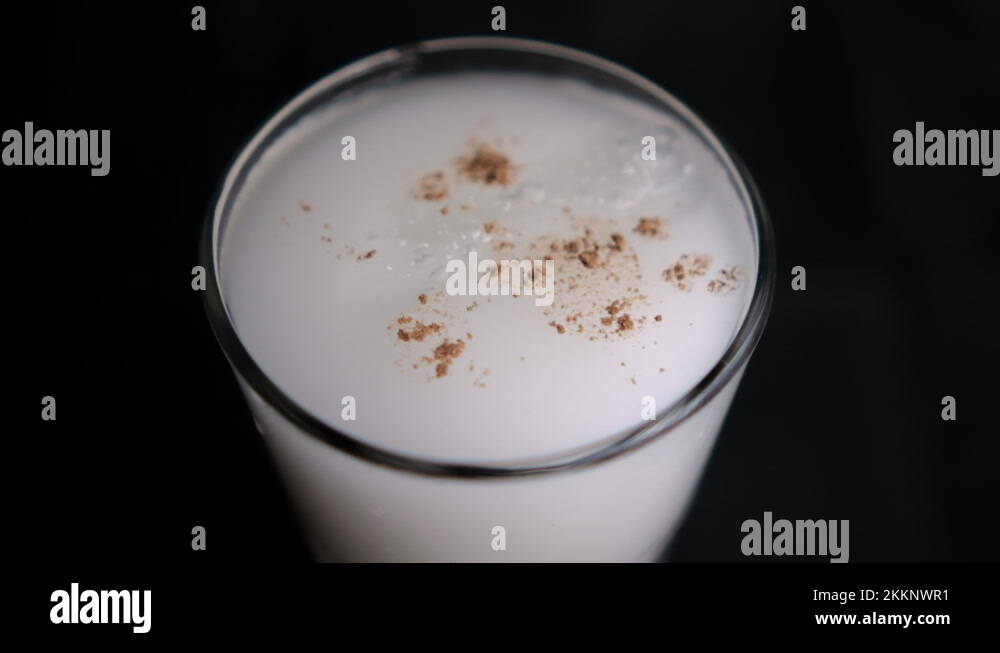 Glass of traditional Mexican horchata water with black background Stock ...
