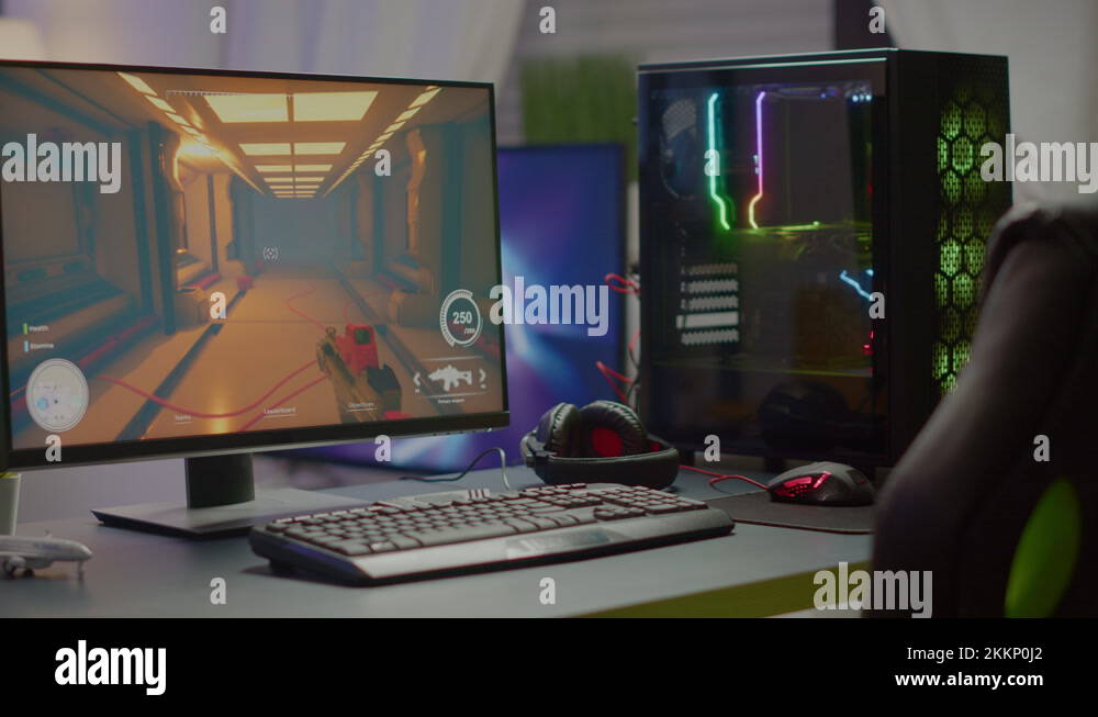 RGB powerful computer with first-person shooter game on screen Stock ...