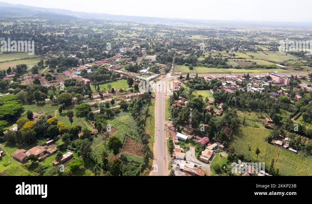 Suburban village of Loitokitok Kenya slopes of Mount Kilimanjaro. Bird ...