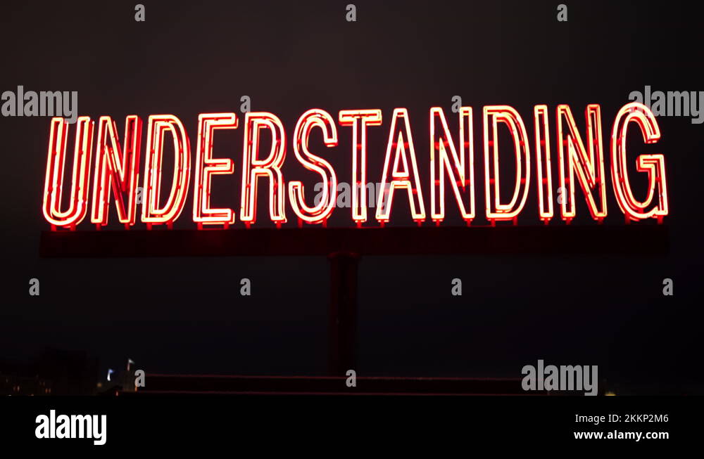 Large Red Neon Sign On Platform Saying Understanding Lit Up During ...