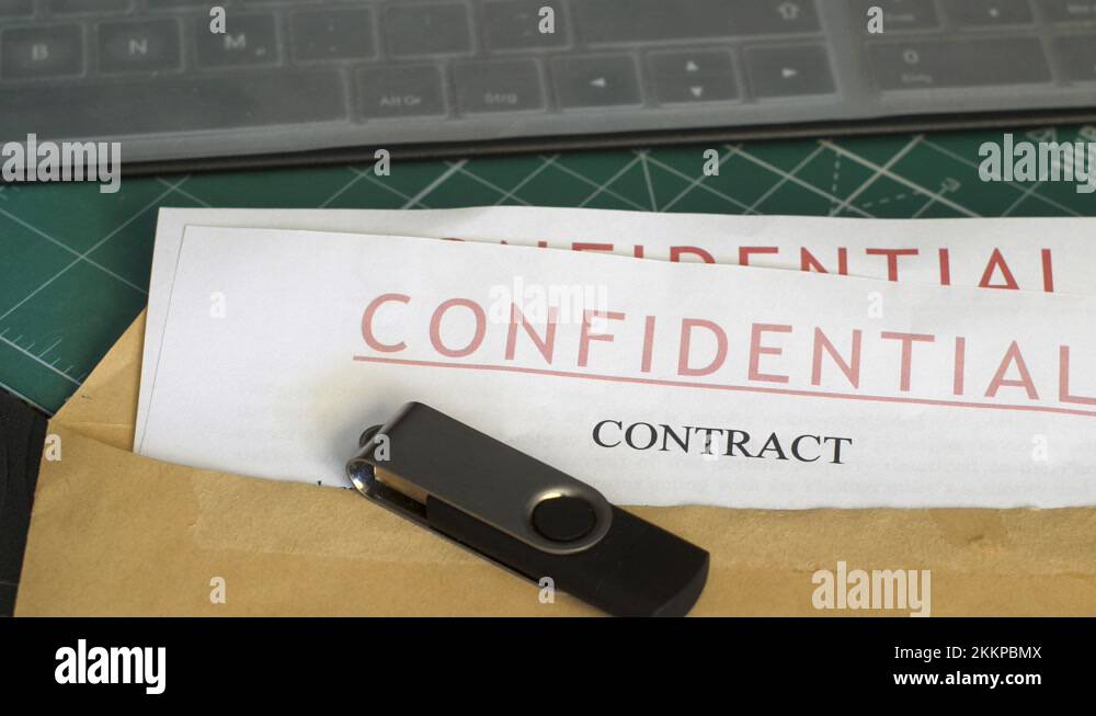 Opened letter with confidential papers and USB stick as a symbol for a ...