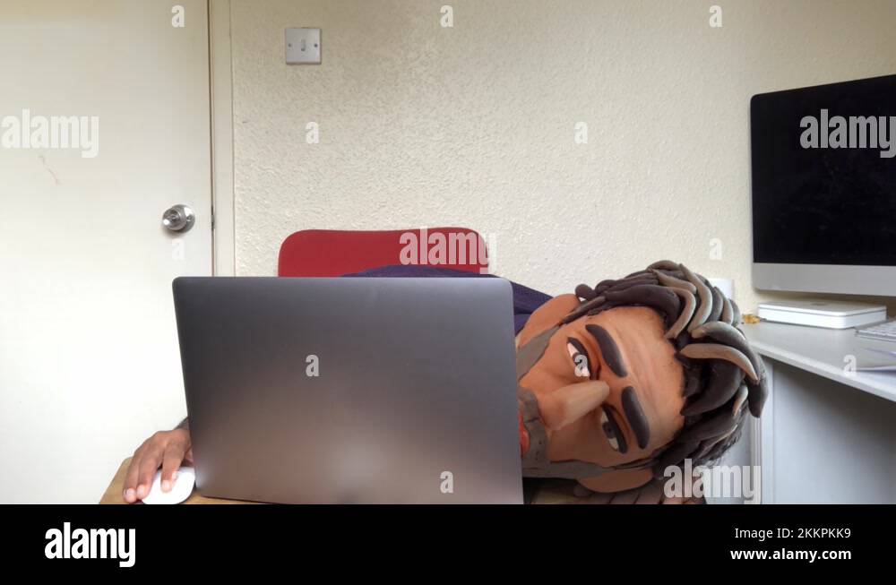 Claymation animated overworked man sleeping on laptop Stock Video ...