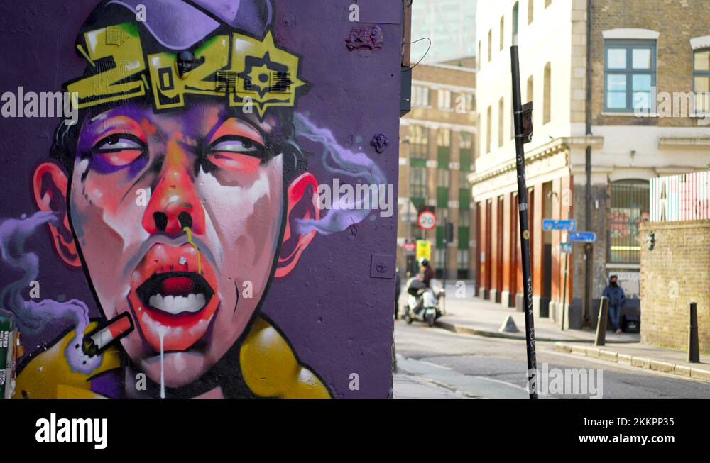 Street art in Brick Lane in London, graffiti of a frustrated and insane ...