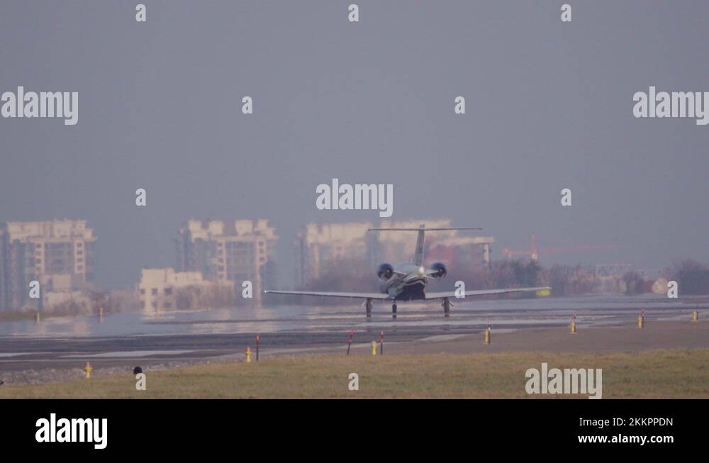 Business jet (bizjet or private jet) is taxiing on the runway before ...