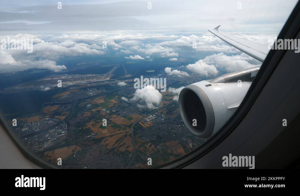 Look out from plane window, Frankfurt airport seen through opening in ...