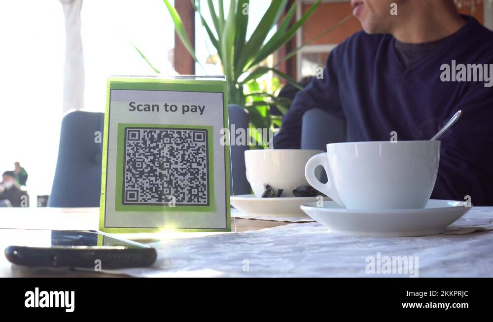 Display with qr code on the table in the restaurant. Contactless ...