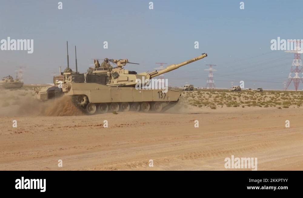 US Army Abrams battle tank tracking through desert in UAE during Iron ...