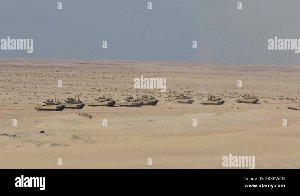 Battle tanks firing guns in desert during Iron Union exercise in UAE ...