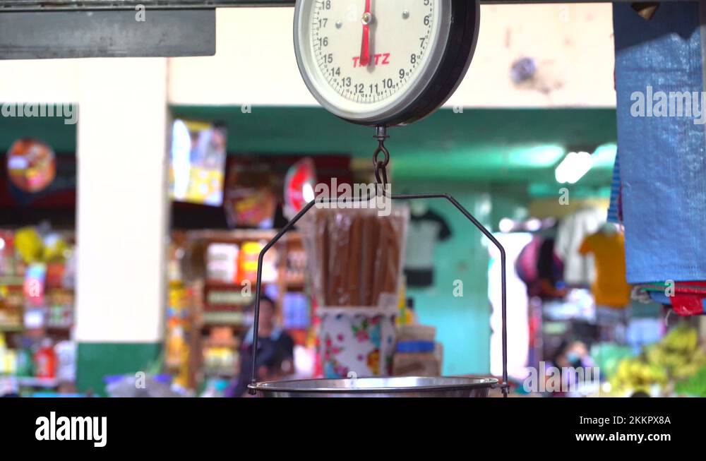 Weighing scale at public market Stock Video Footage - Alamy