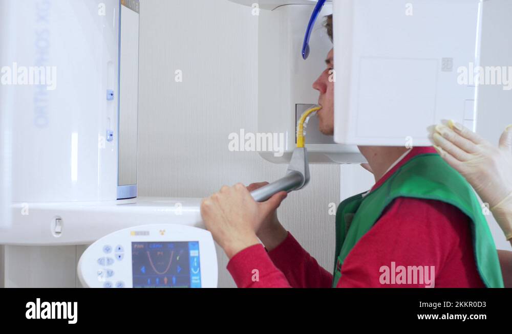 Dental X-Ray scanner makes a panoramic radiograph of the jaw of young ...