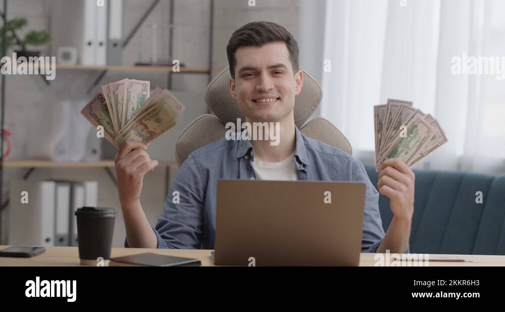 Successful Young Freelancer Waving Money with Happy Emotions sitting at ...