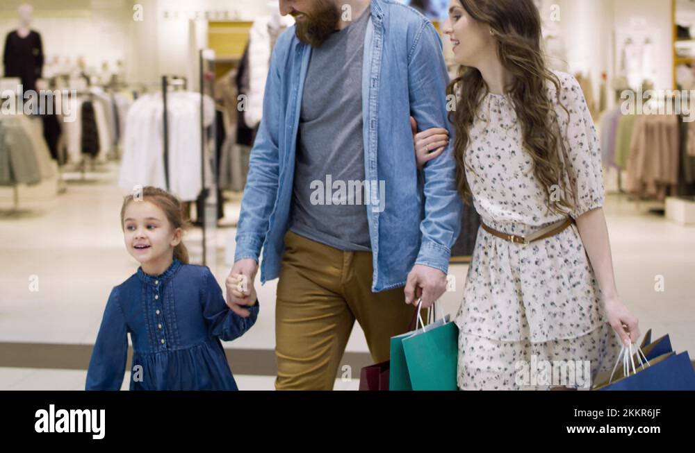 Video of happy family strolling in shopping mall Stock Video Footage ...