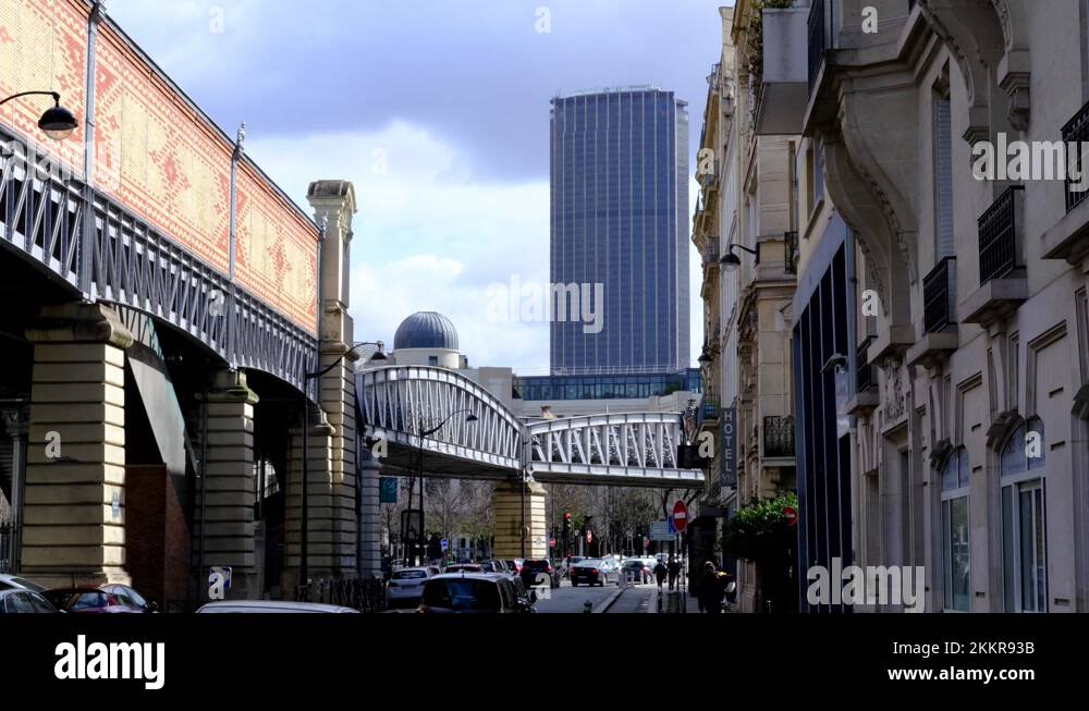 Parisian overground metro structure with cloudy sky and Montparnasse ...