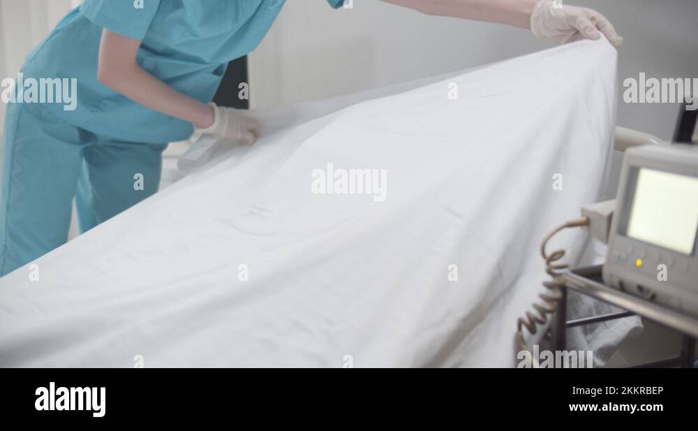 Nurse covering dead patient with sheet in emergency room Stock Video ...