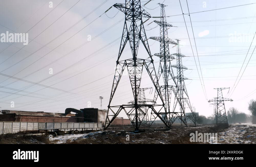 High voltage electricity tower and power lines in the industrial zone ...