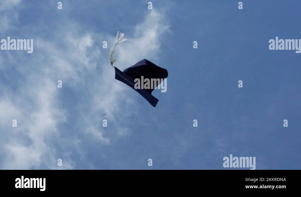 Single graduation cap flying in the air. Virtual graduation, social ...