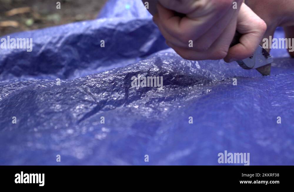 Cutting tarpaulin Stock Videos & Footage - HD and 4K Video Clips - Alamy