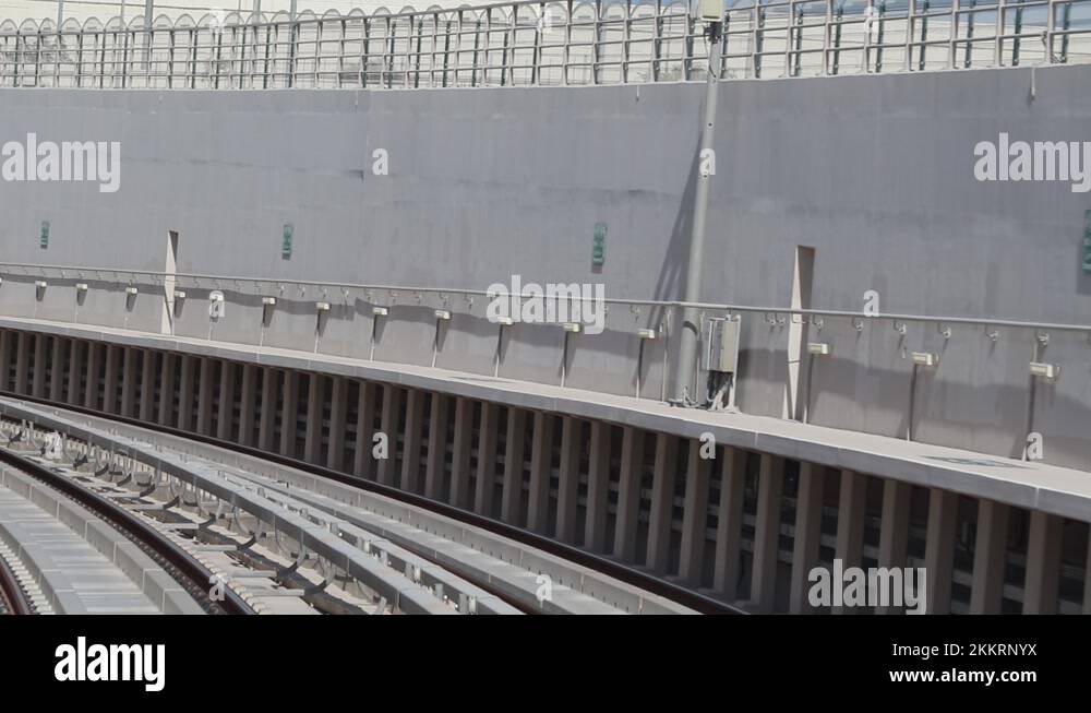 A red line Metro train on a curve track Stock Video Footage - Alamy