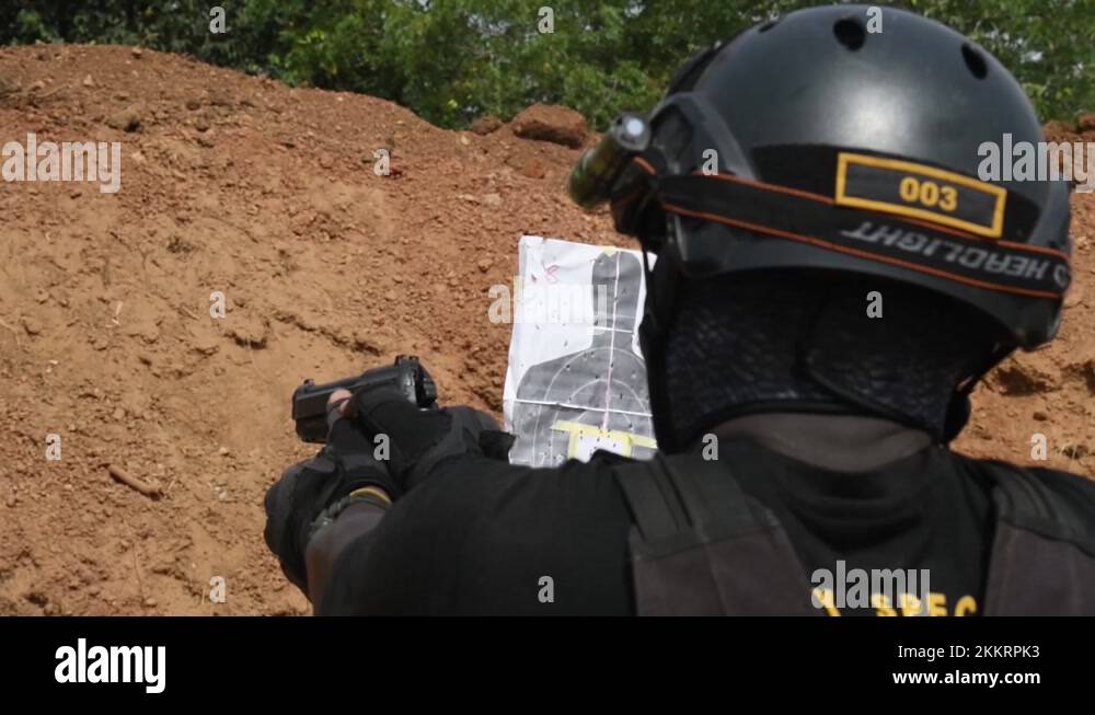 Ghanaian Special Forces soldier firing pistol Stock Video Footage - Alamy