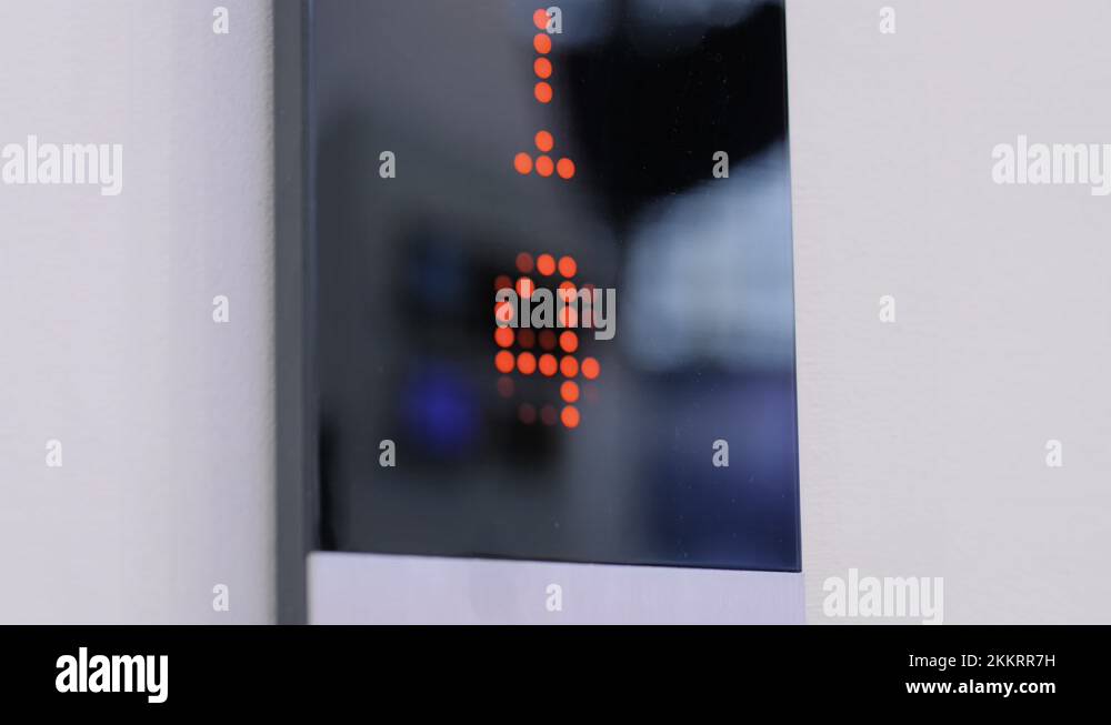 Digital elevator display showing floor number - lift going up: close up ...