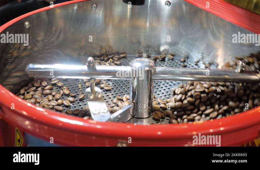 Coffee roaster machine during work - mixing and roasting process Stock ...