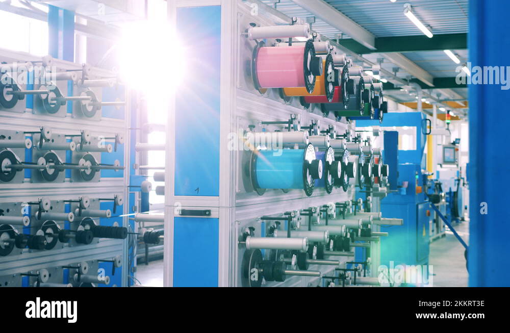 Multiple multi-colored spools of wire spinning on the wall Stock Video ...