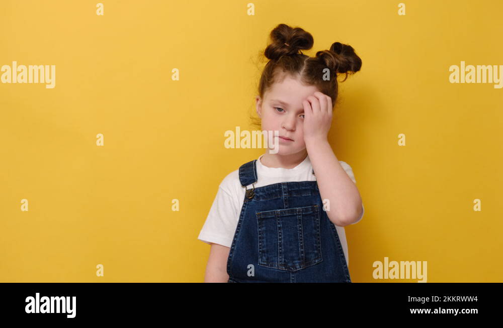 Thoughtful little girl child touch chin with finger thinking or ...