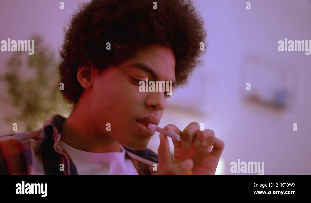 Teenager smoking weed at night club party, unhealthy lifestyle, bad ...