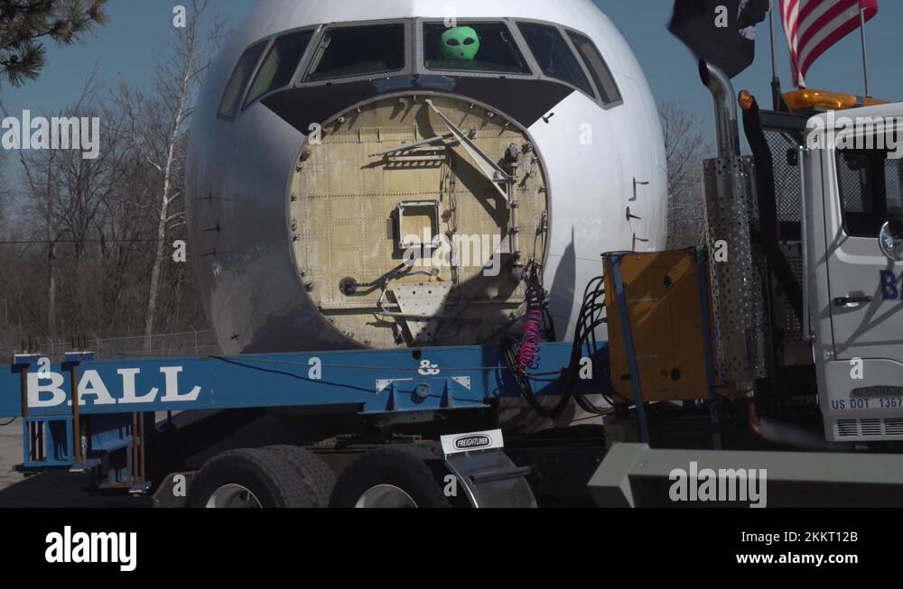 Truck turning with oversize load of 767 Fuselage on trailer Stock Video ...