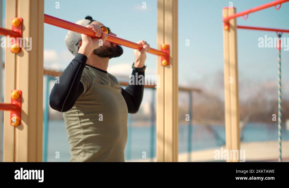 Pullups Workout Outdoors.Muscle Up In Public Gym.Healthy Man Pull-ups ...