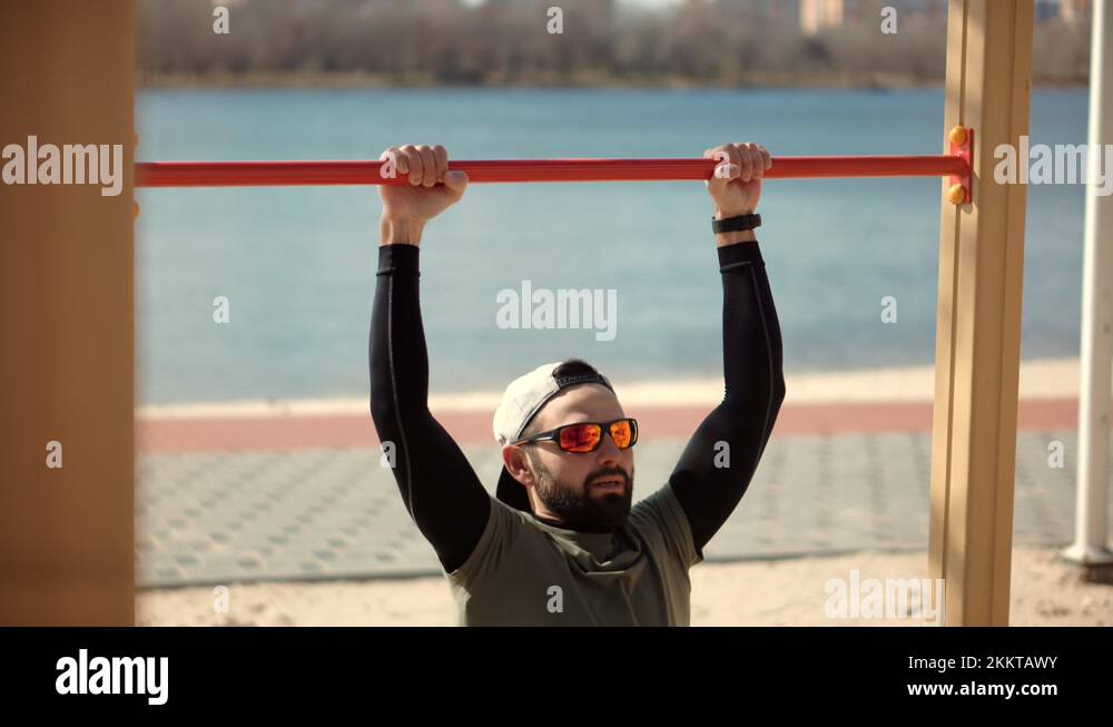 Pullups Workout Outdoors.Muscle Up In Public Gym.Healthy Man Pull-ups ...