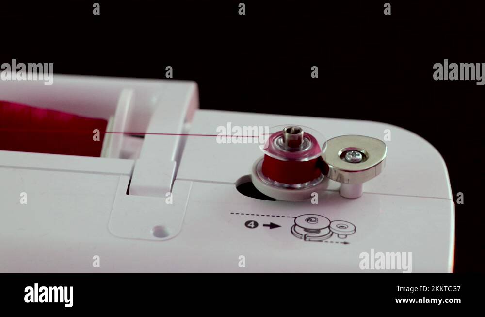 White sewing machine winding thread. Black background Stock Video ...