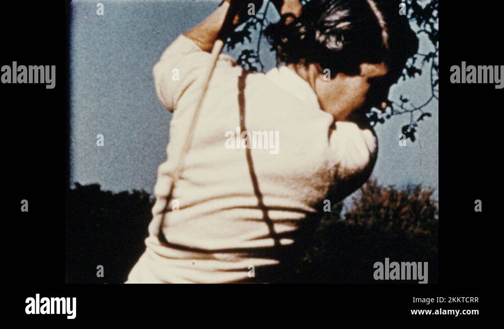 1950s: Bowling pins knocked down by ball. People bowling. Woman swings ...