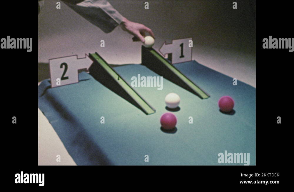 1960s: Two numbered ramps on cloth with four balls. Two balls placed on ...