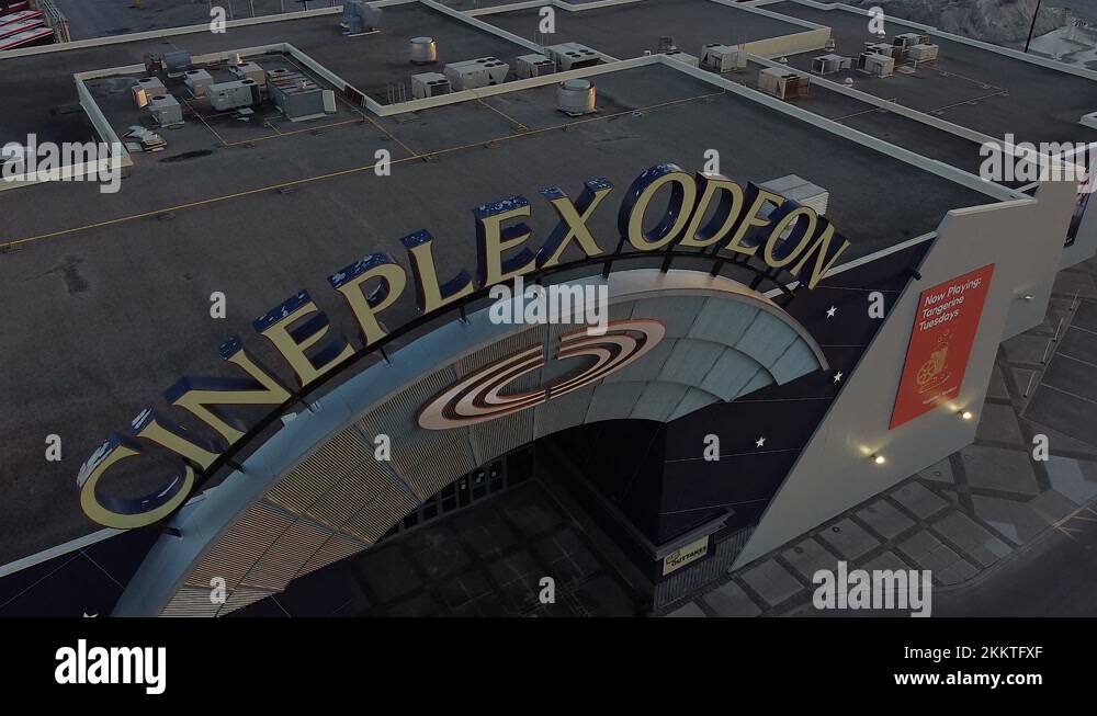 360 reveal of Cineplex Odeon movie theatre cinema exterior with signage ...