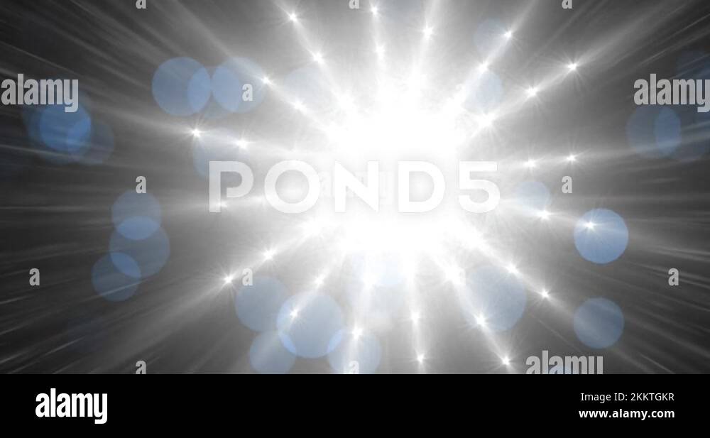 Digital animation of blue bokeh spots of light over bright spot of ...