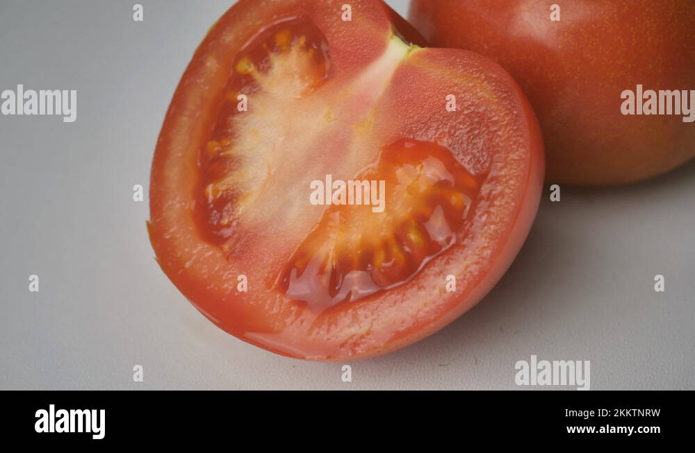 Fresh tomato cutaway with circular rotation. Healthy eating and diet ...