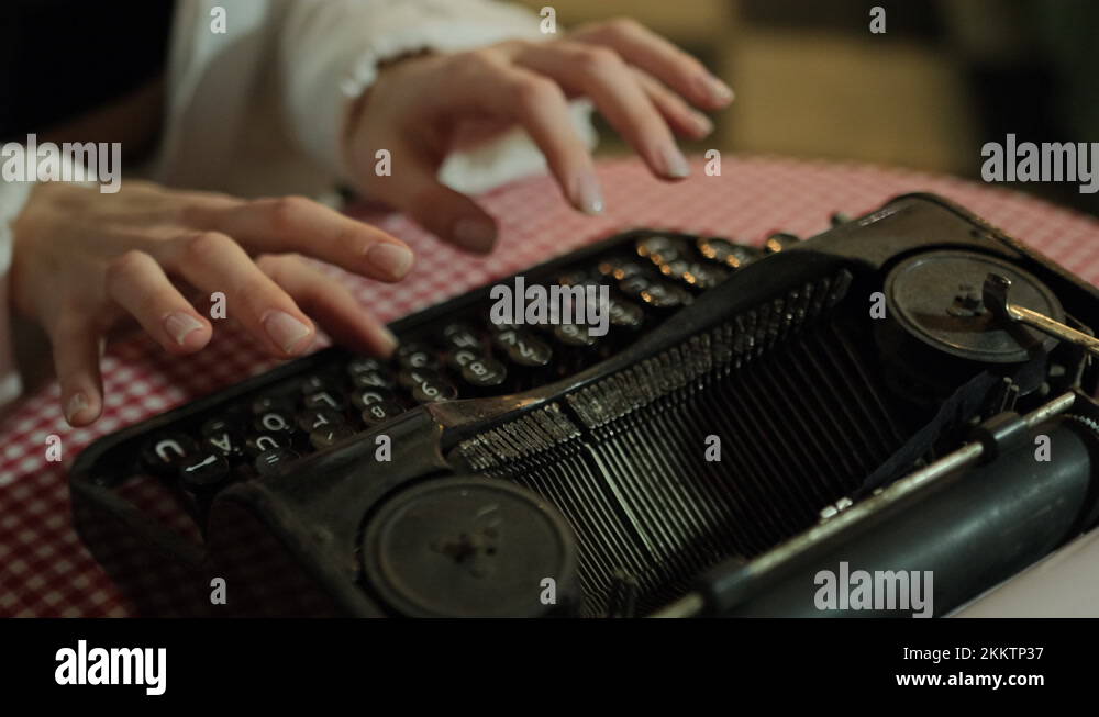Secretary at old typewriter. Business concepts. Retro. Pensive hands ...