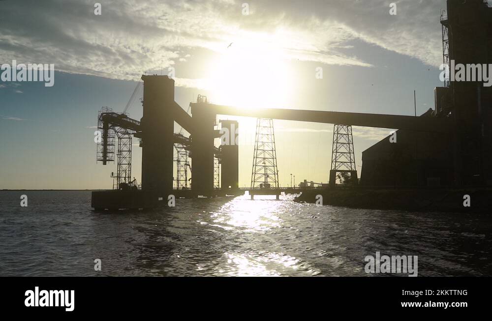 Grain Loading Terminal In Silhouette Against Bright Sun. Port Of ...