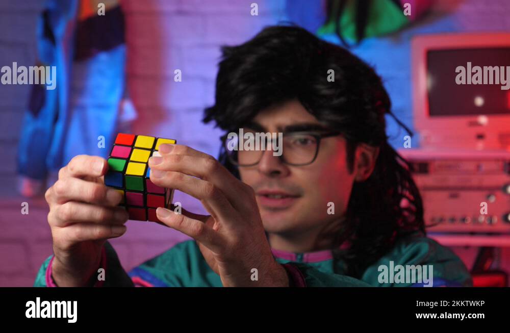 Solving a Rubik Cube in the 80s 90s Retro Look Stock Video Footage - Alamy