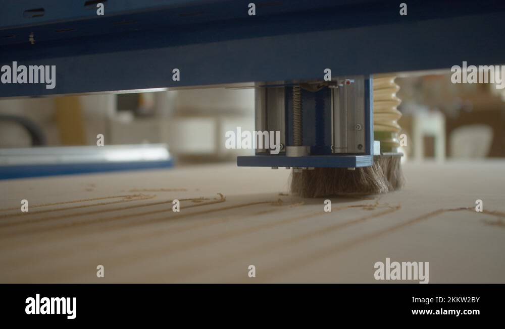 Milling machine cut letters out of plywood. Flying flakes shavings ...