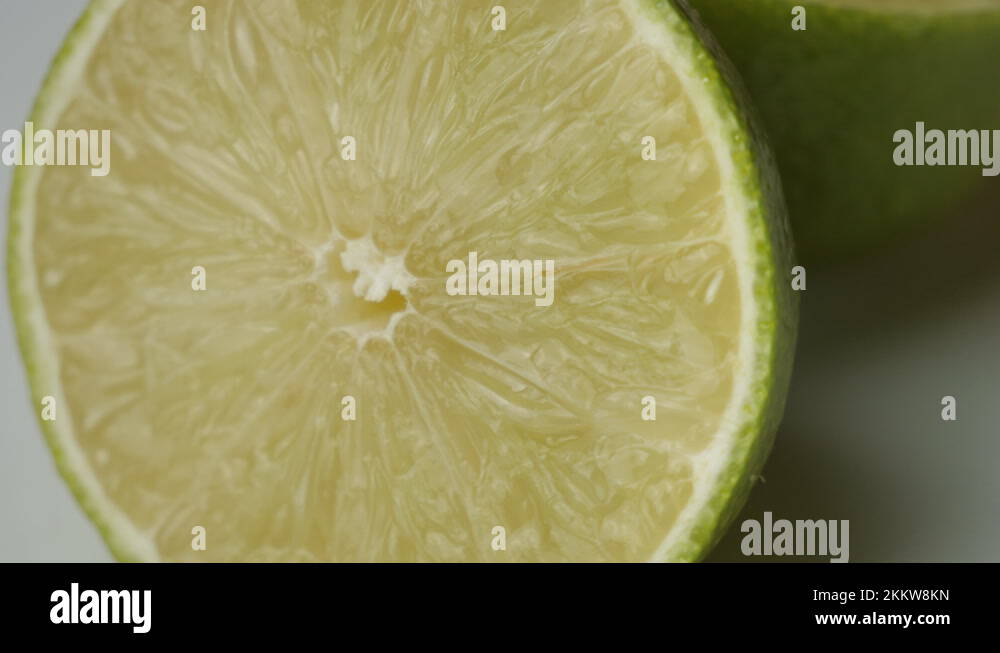 Fresh cut lime with circular rotation. Healthy eating and diet concept ...