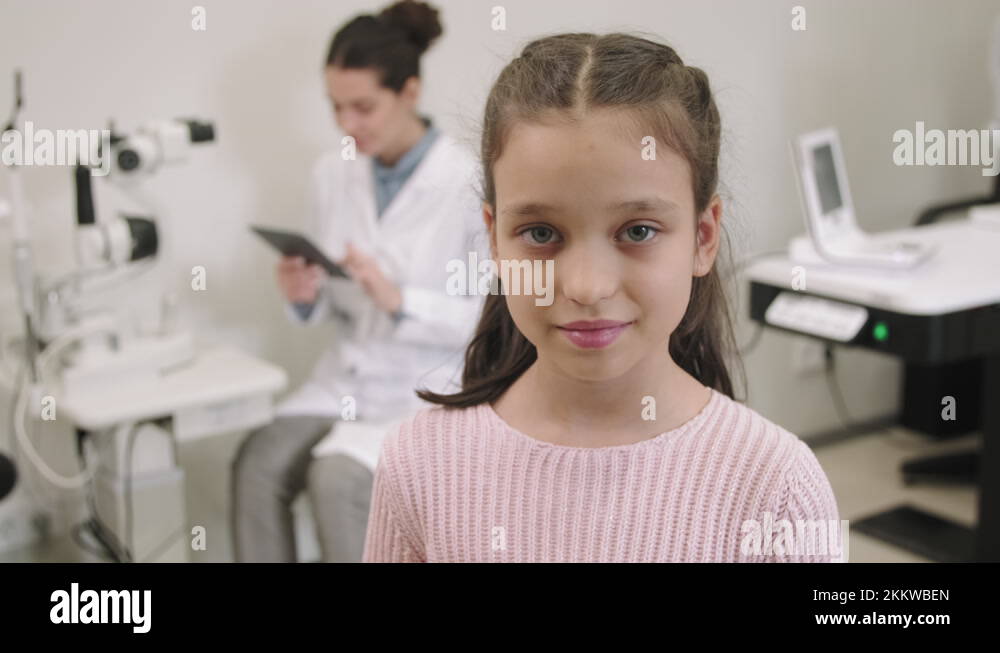 Portrait Of Little Girl At Oculist Office Stock Video Footage - Alamy