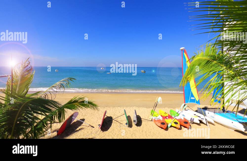 Sun light ray n bokeh lens flare effect over cyan deep blue sea water ...