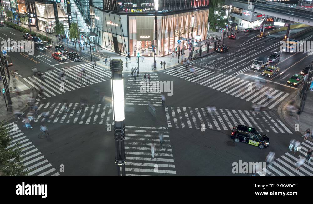 Busy Traffic Intersection In Front Of Tokyo Ginza Shopping Plaza In The ...