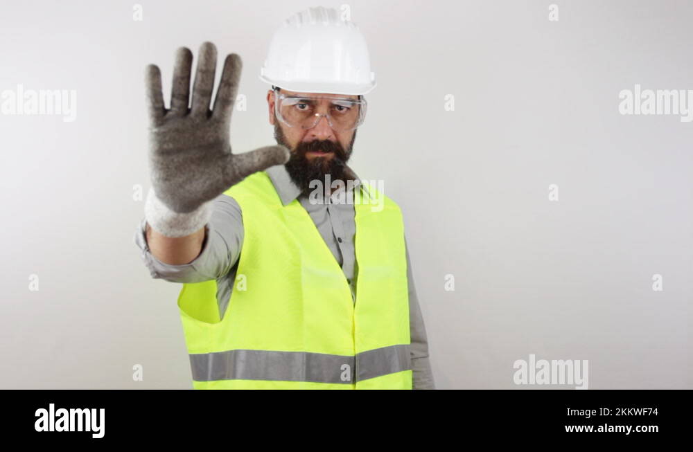 Engineer wearing work helmet doing negative stop sign with hand Stock ...